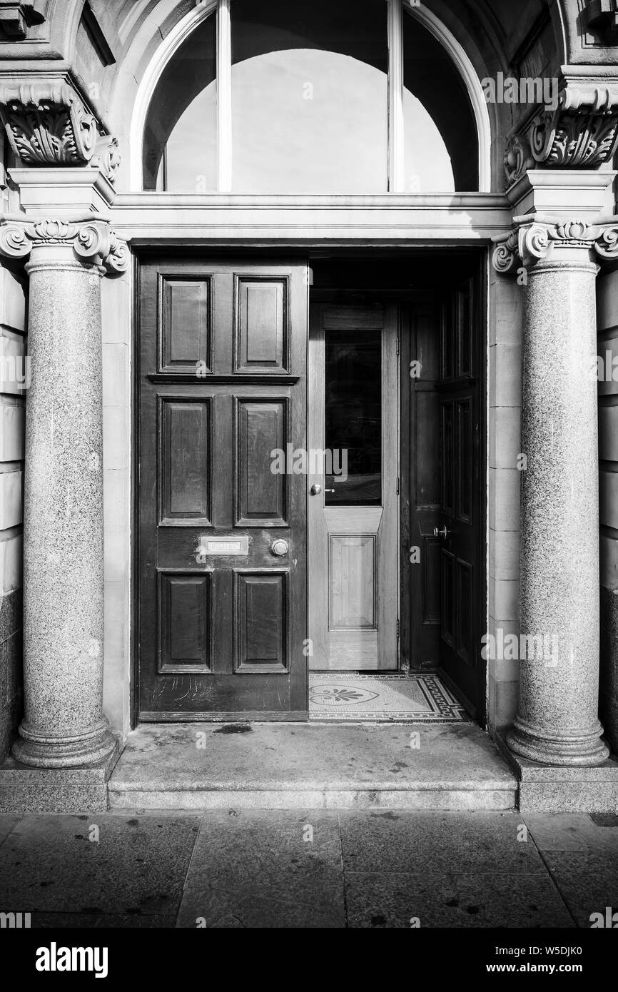 Panelled wooden doors at the entrance to an old victorian office ...