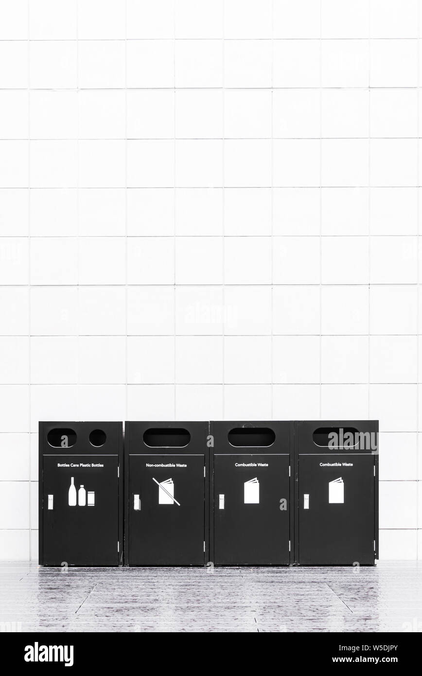 Recycle bins for rubbish, recycling and garden waste, over white wall ...