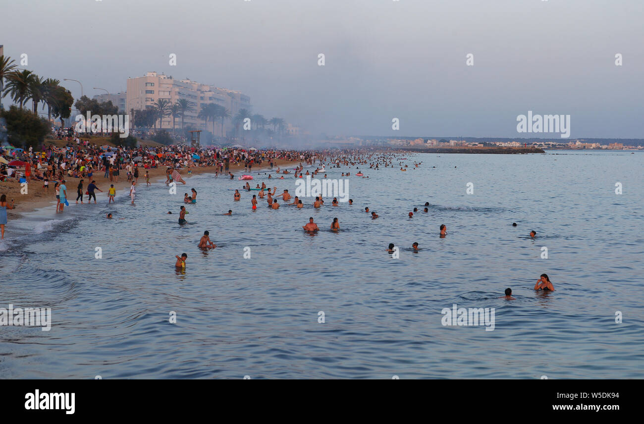 Palma de Mallorca, Spain / June 23, 2019: People meet in the beach near ...