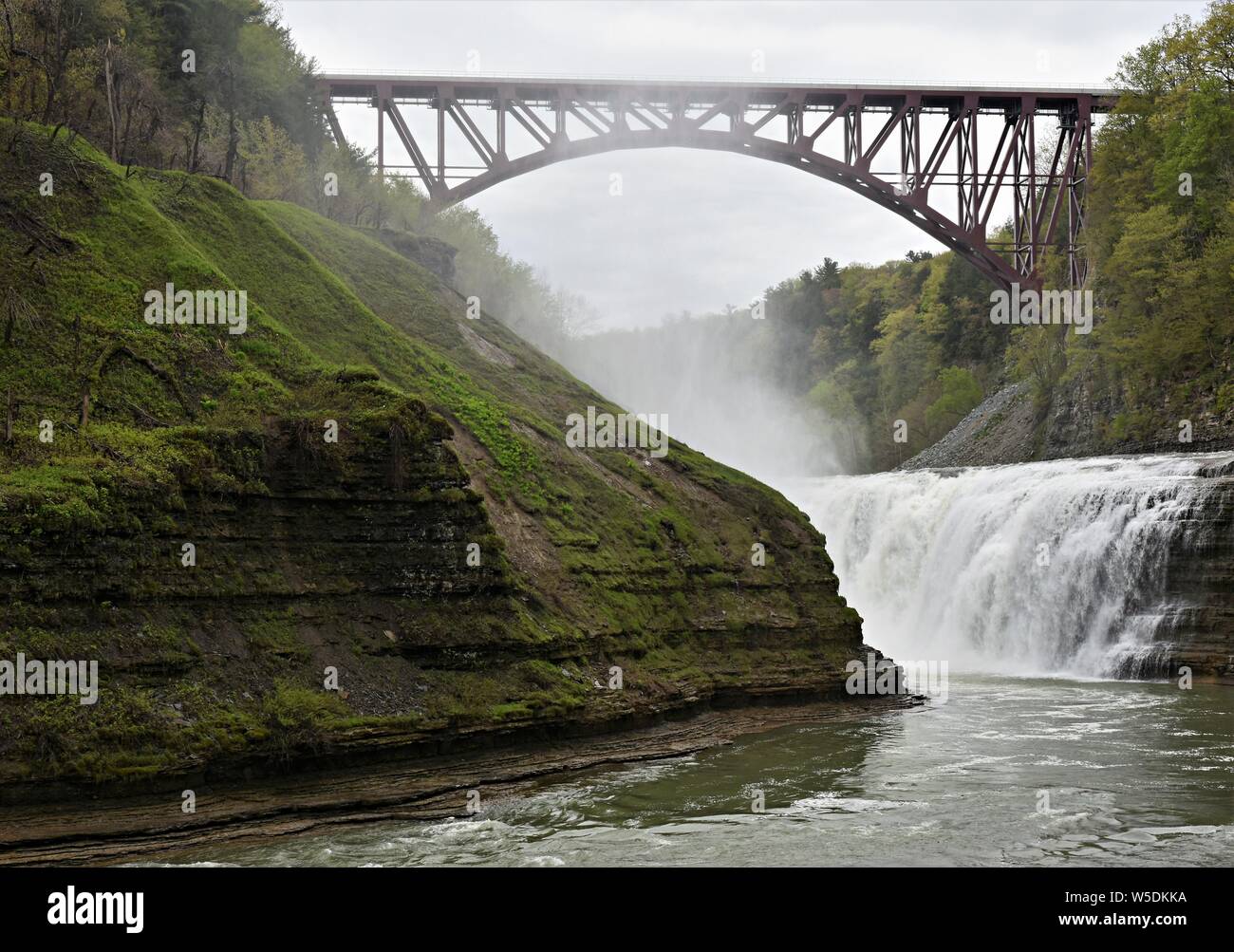 The upper falls cascades under the train bridge in this image from ...