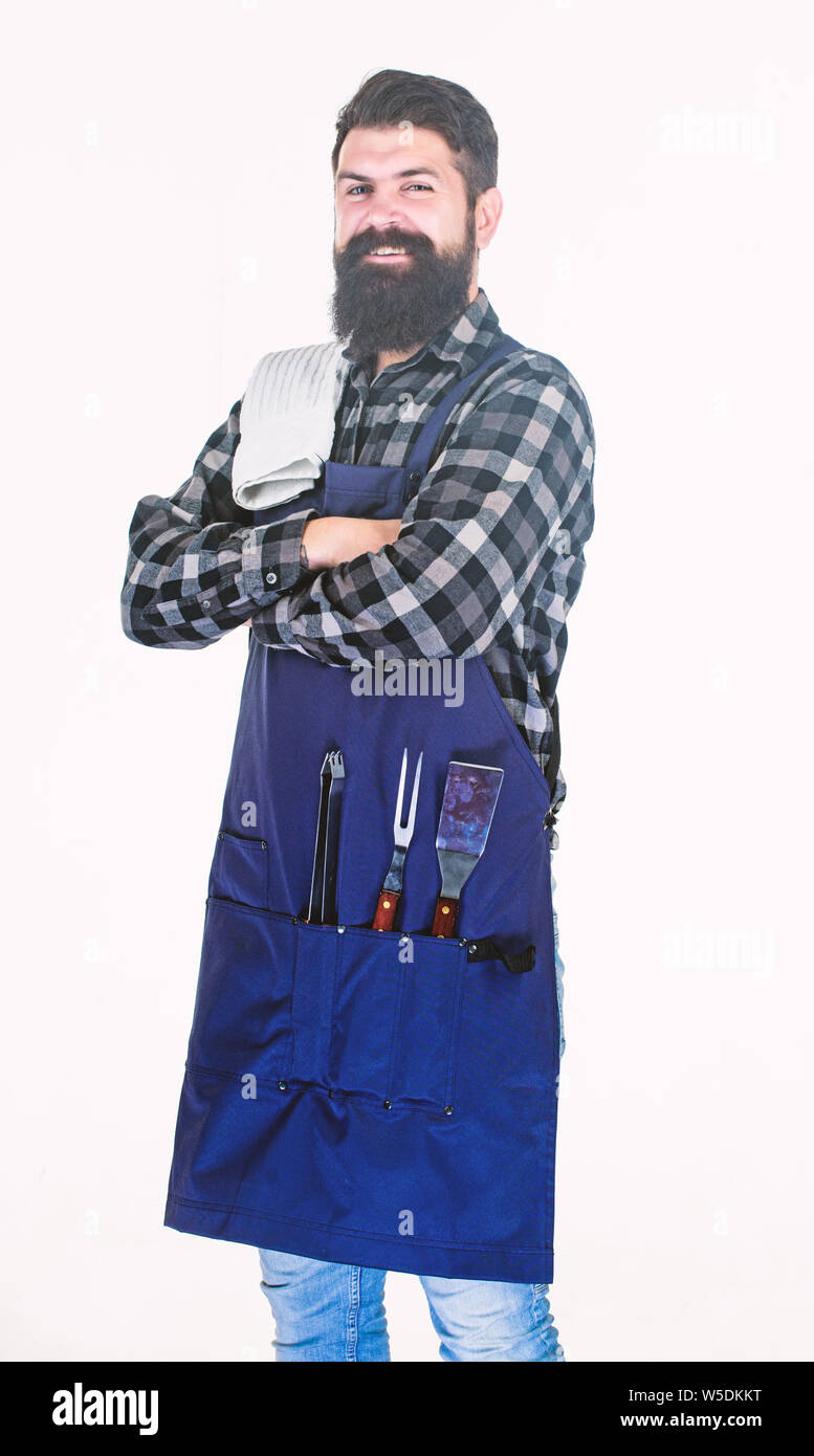 Skilled and confident. Grill master keeping his hand crossed with ...