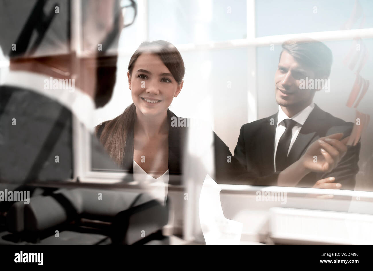 close up.employees on the background of a modern office Stock Photo - Alamy