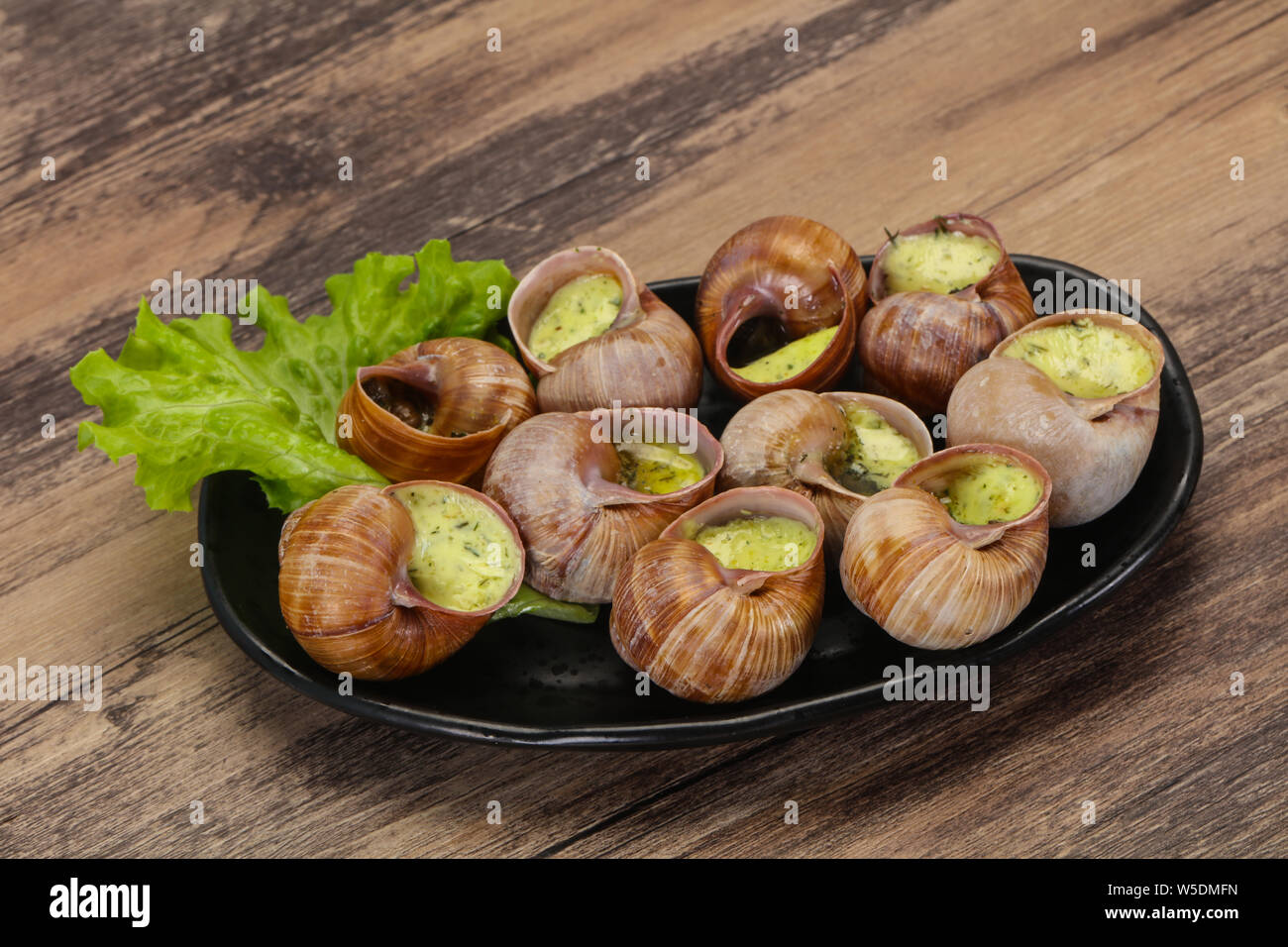 French cuisine - Escargot with butter sauce Stock Photo - Alamy