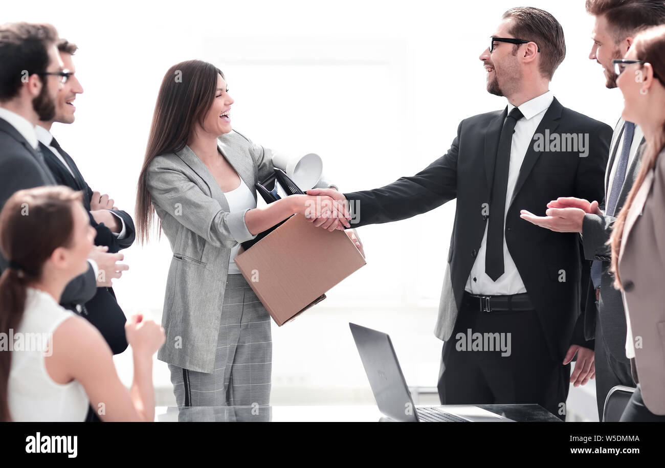 project Manager shaking hands with the new employee Stock Photo - Alamy