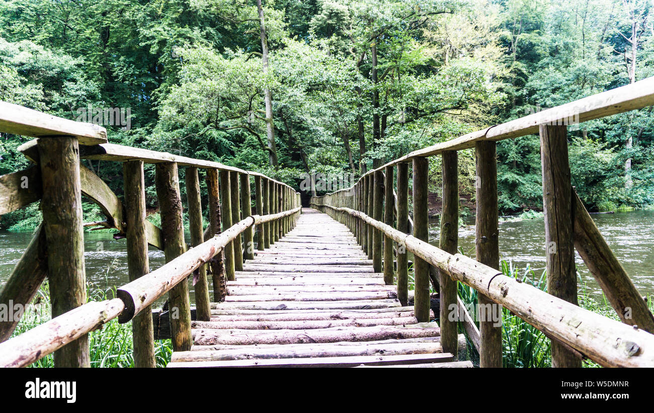 wooden bridge over river Stock Photo - Alamy