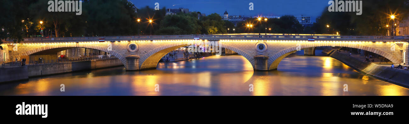The night panoramic view of pont Louis-Philippe. It is a bridge across ...