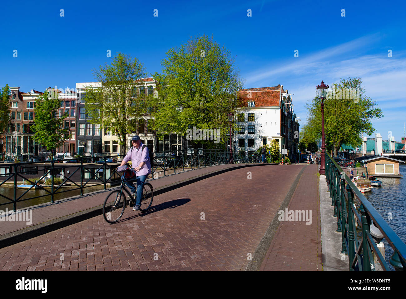 People ride bikes in Amsterdam, Netherlands Stock Photo - Alamy