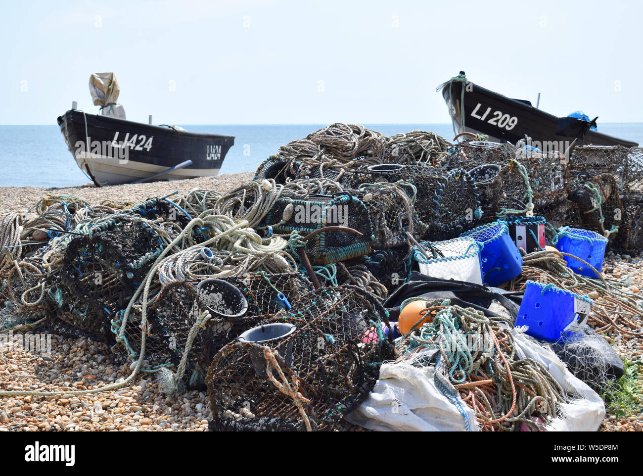 Lobster pots and fishing boats on the beach at Bognor Regis in the ...