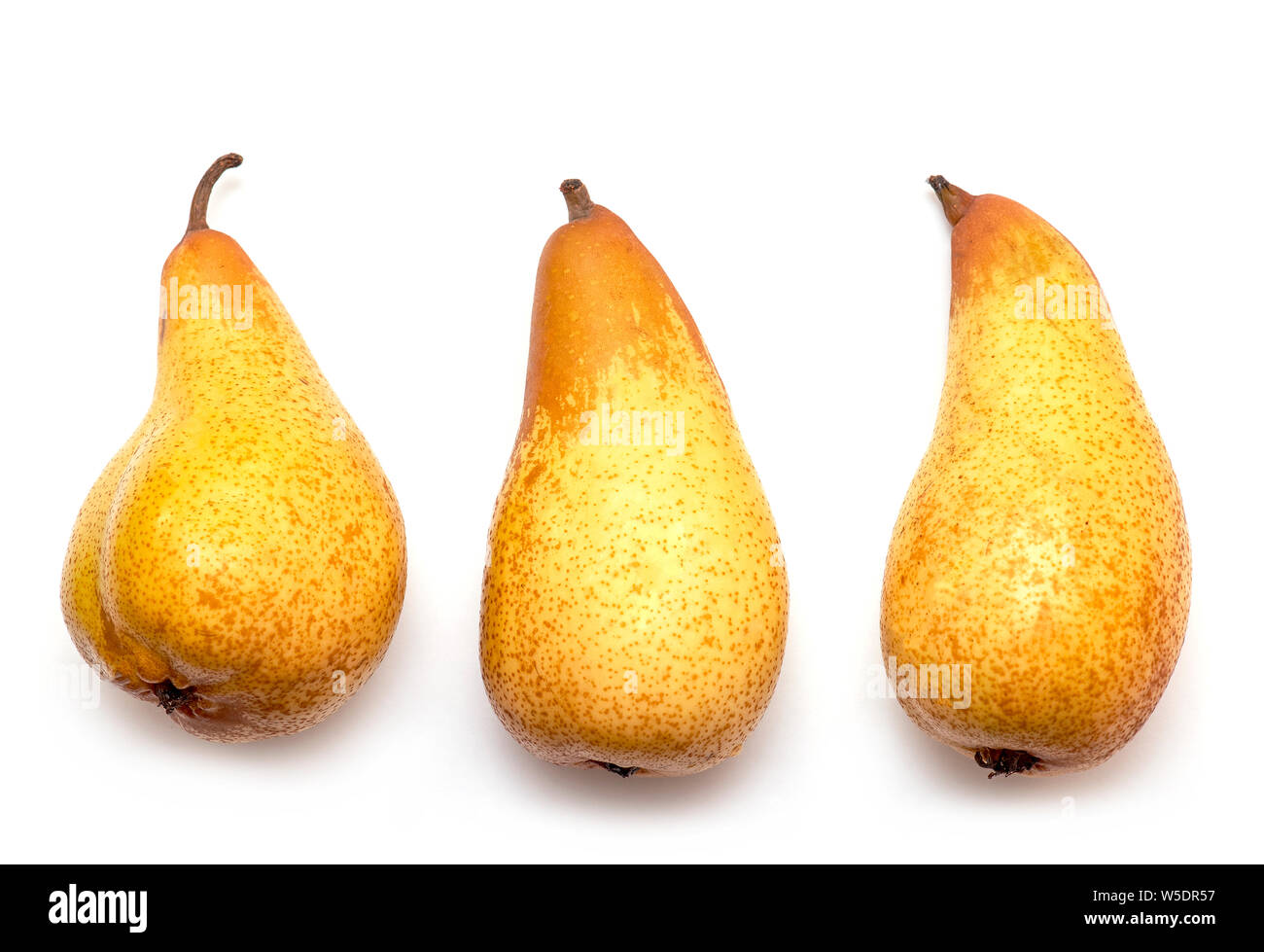 Three Yellow Pears isolated on white Background - top view. Row of raw ...
