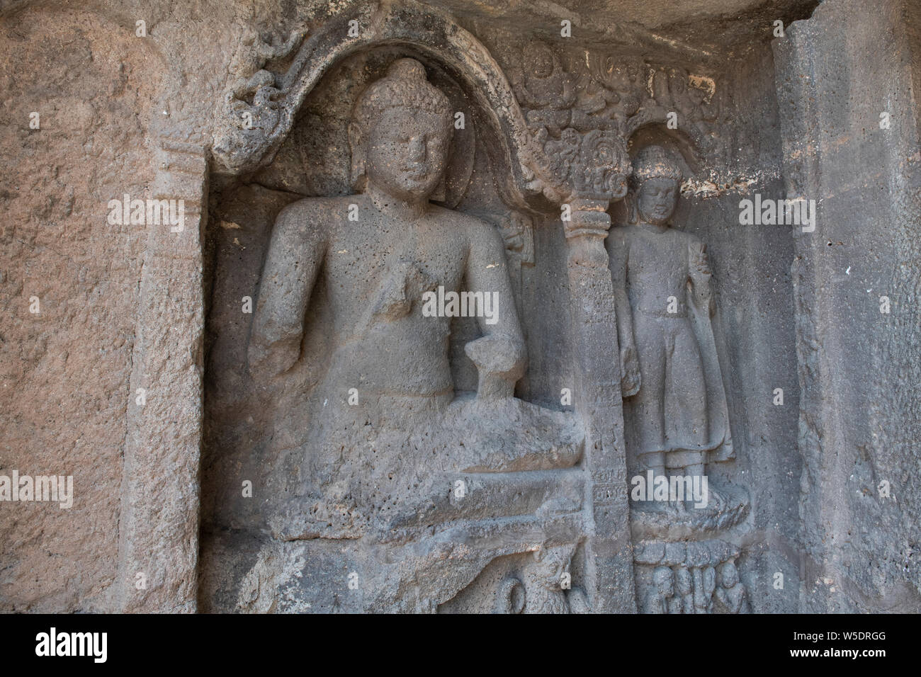 India, Maharashtra, Ajanta, Ajanta Caves. Detail of ornate stone wall ...