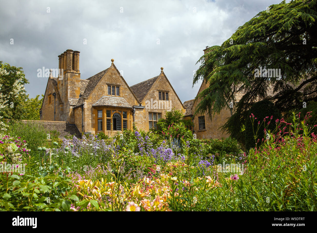 English country house in the grounds of national trust property of ...