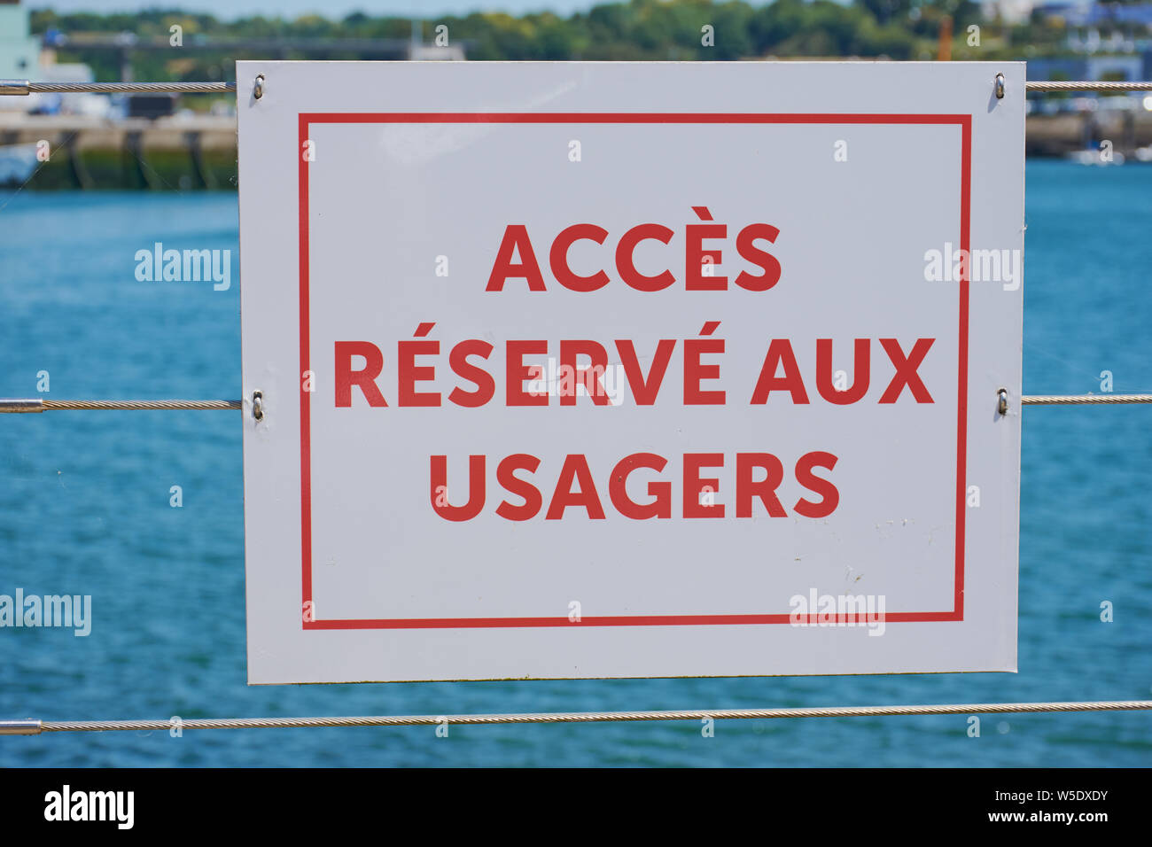sign in French language at a harbor in France, the text in English ...