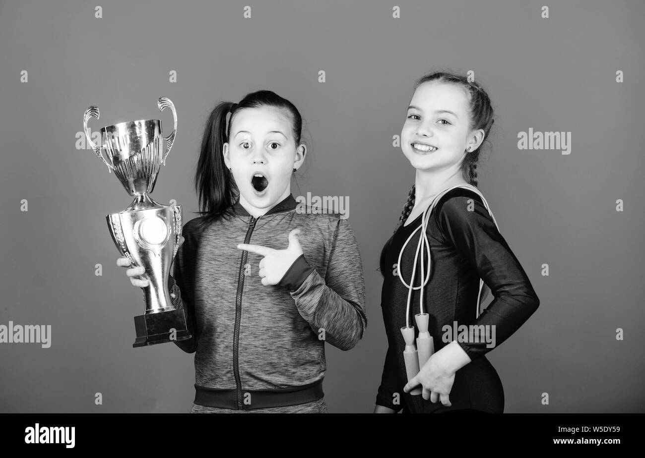 Deserved award. Girls athletic kids celebrate victory. Athletic girls ...