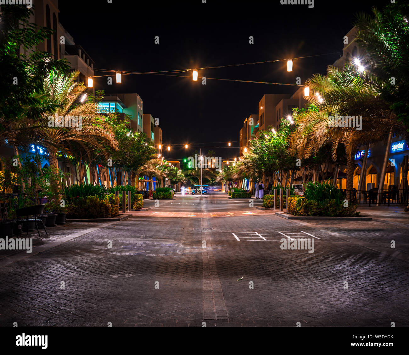 A fully lighted street walkway lighted for some celebrations or events ...