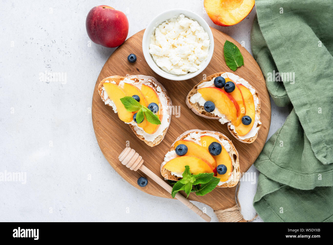 Peach And Ricotta Bruschetta On Wooden Serving Board. Healthy Summer ...