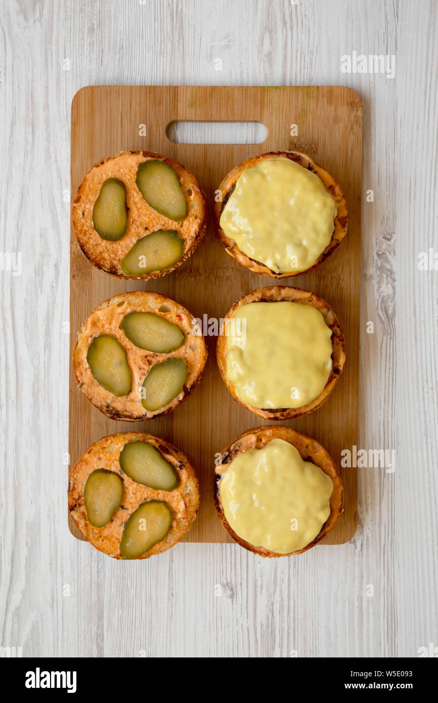 Cooking cheeseburger step-by-step, top view. Overhead, from above, flat ...