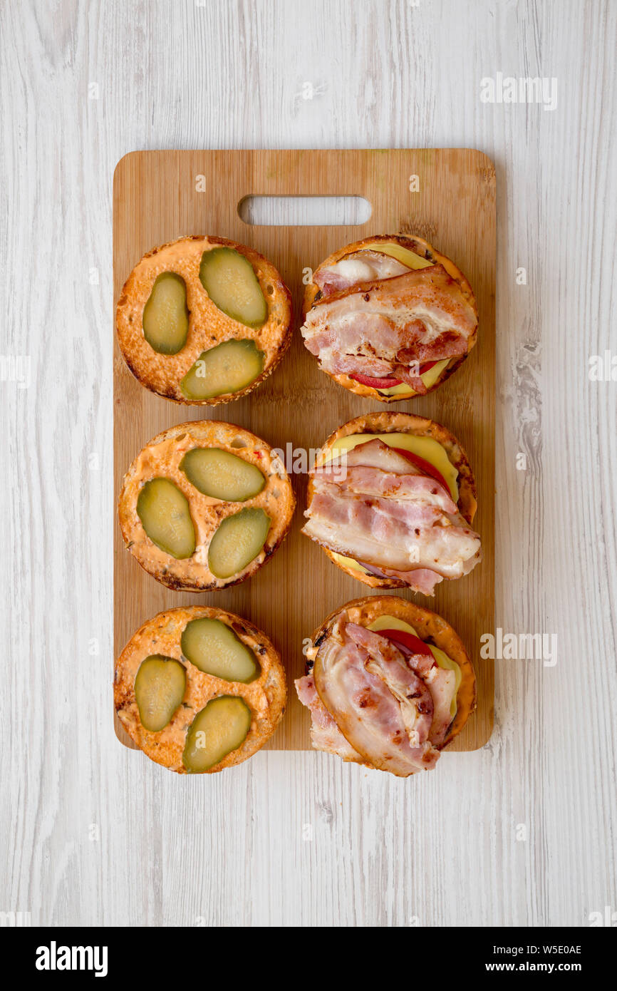 Cooking cheeseburger step-by-step, overhead view. Flat lay, from above ...