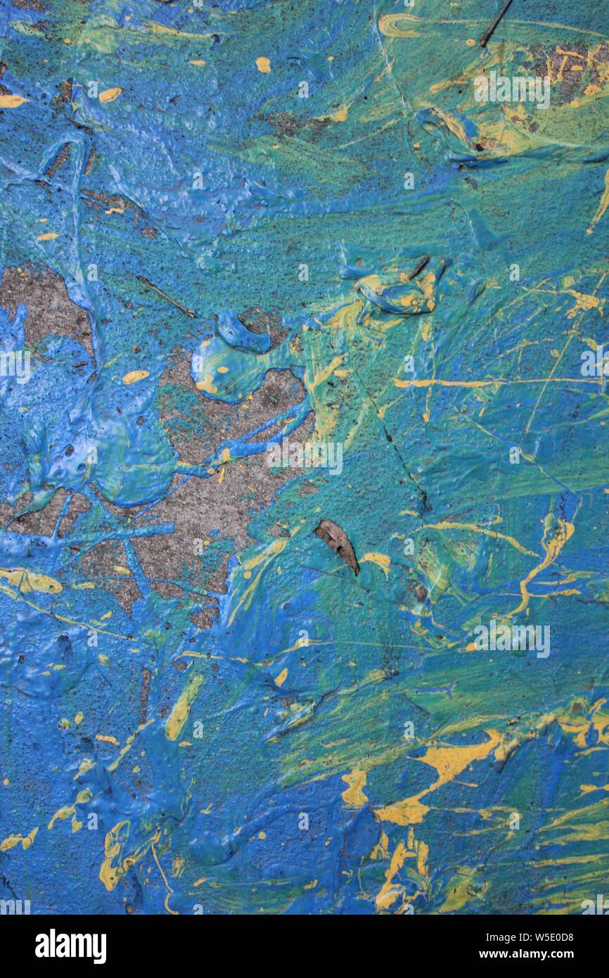 Blue and yellow paint splashed on a sidewalk Stock Photo - Alamy