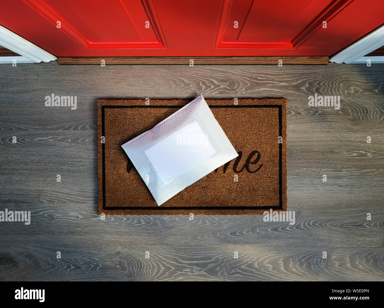 Messenger envelope pack delivered to door step. Overhead view. Copy ...