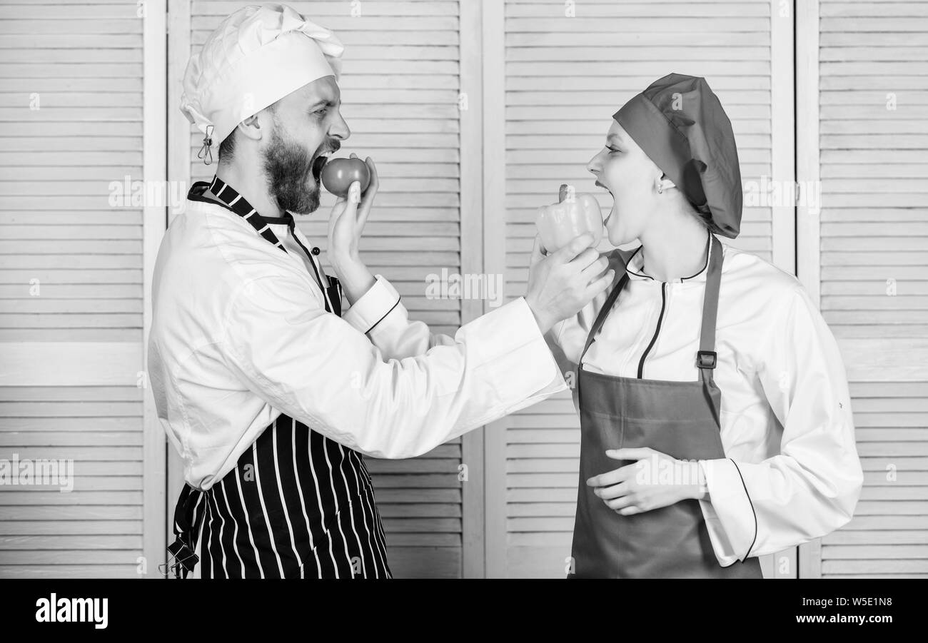 Spending nice time at home. vegetarian. cook uniform. man and woman ...