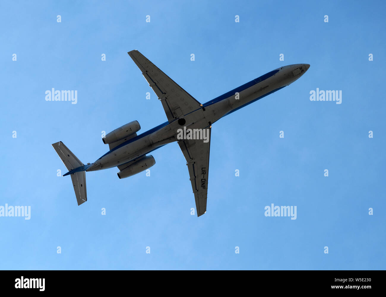 Embraer ERJ-145EU with registration UR-DNF airframe in the blue sky ...