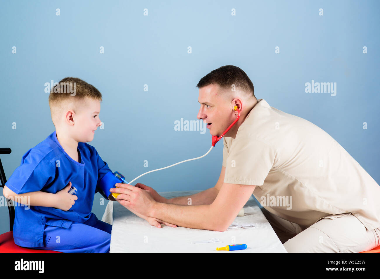 good team. happy child with father with stethoscope. nurse laboratory ...