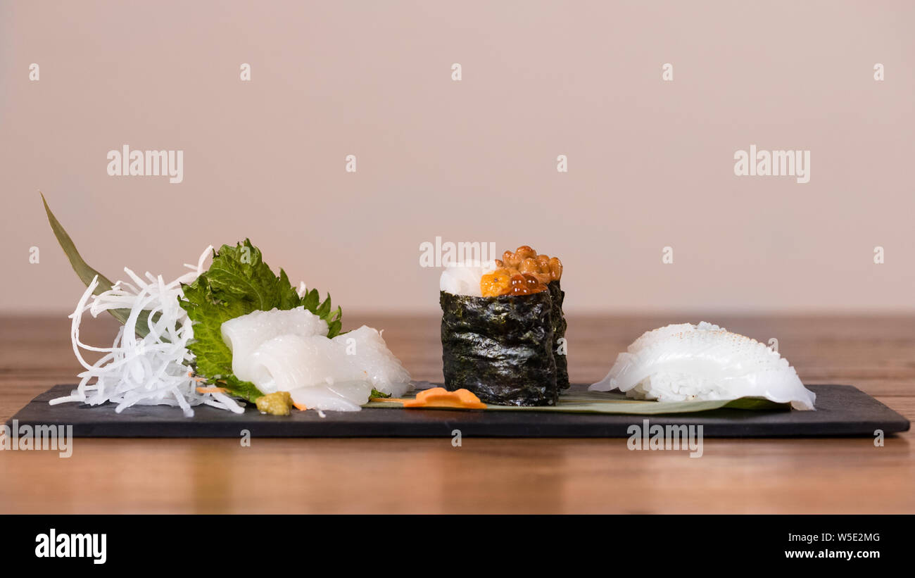 Plate composed of squid and cuttlefish sashimi, caviar and fermented ...