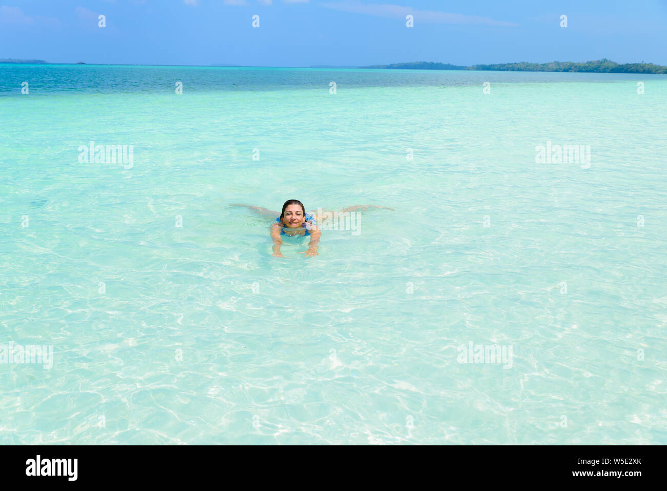 Woman swimming in caribbean sea turquoise transparent water. Tropical ...