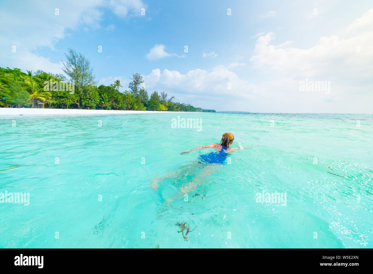 Woman swimming in caribbean sea turquoise transparent water. Tropical ...