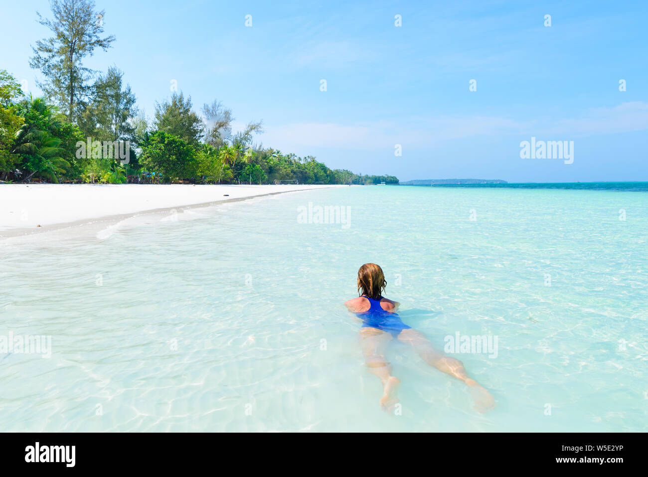 Woman swimming in caribbean sea turquoise transparent water. Tropical ...