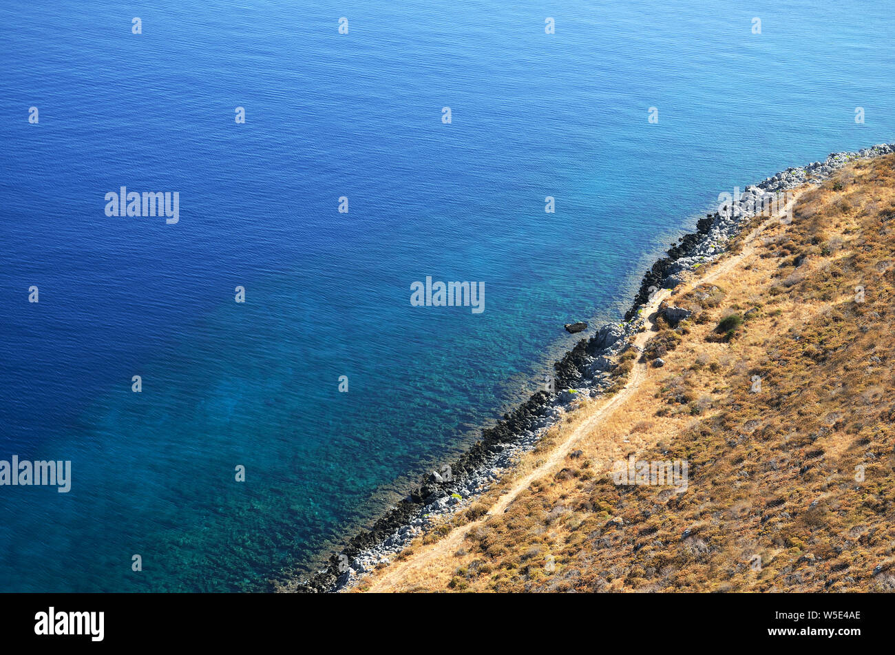 Coastal cliffs and deep blue waters Stock Photo - Alamy
