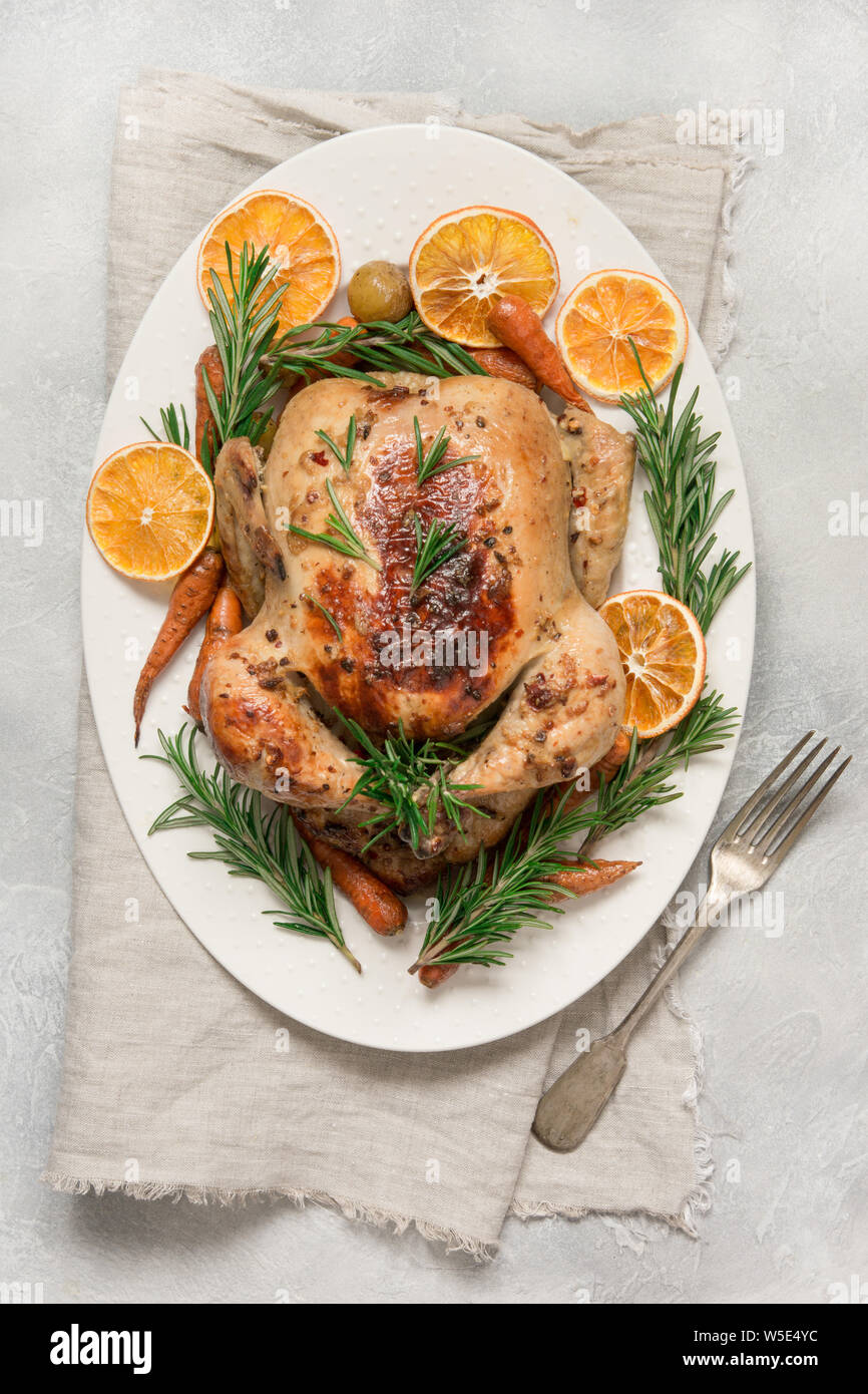 Traditional roasted turkey garnish rosemary on holiday table. Top view ...