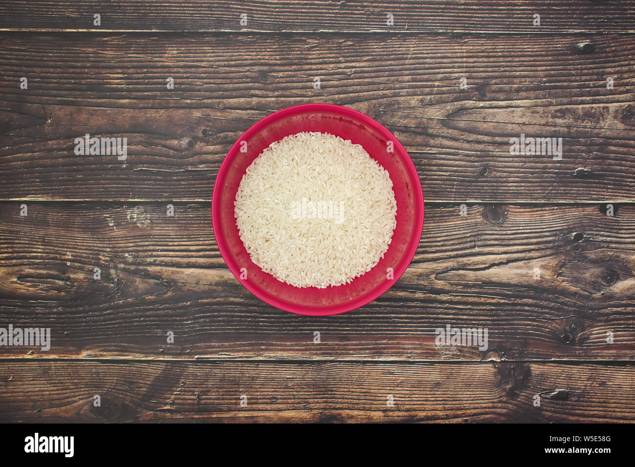 Raw pink rice in bowl hi-res stock photography and images - Alamy