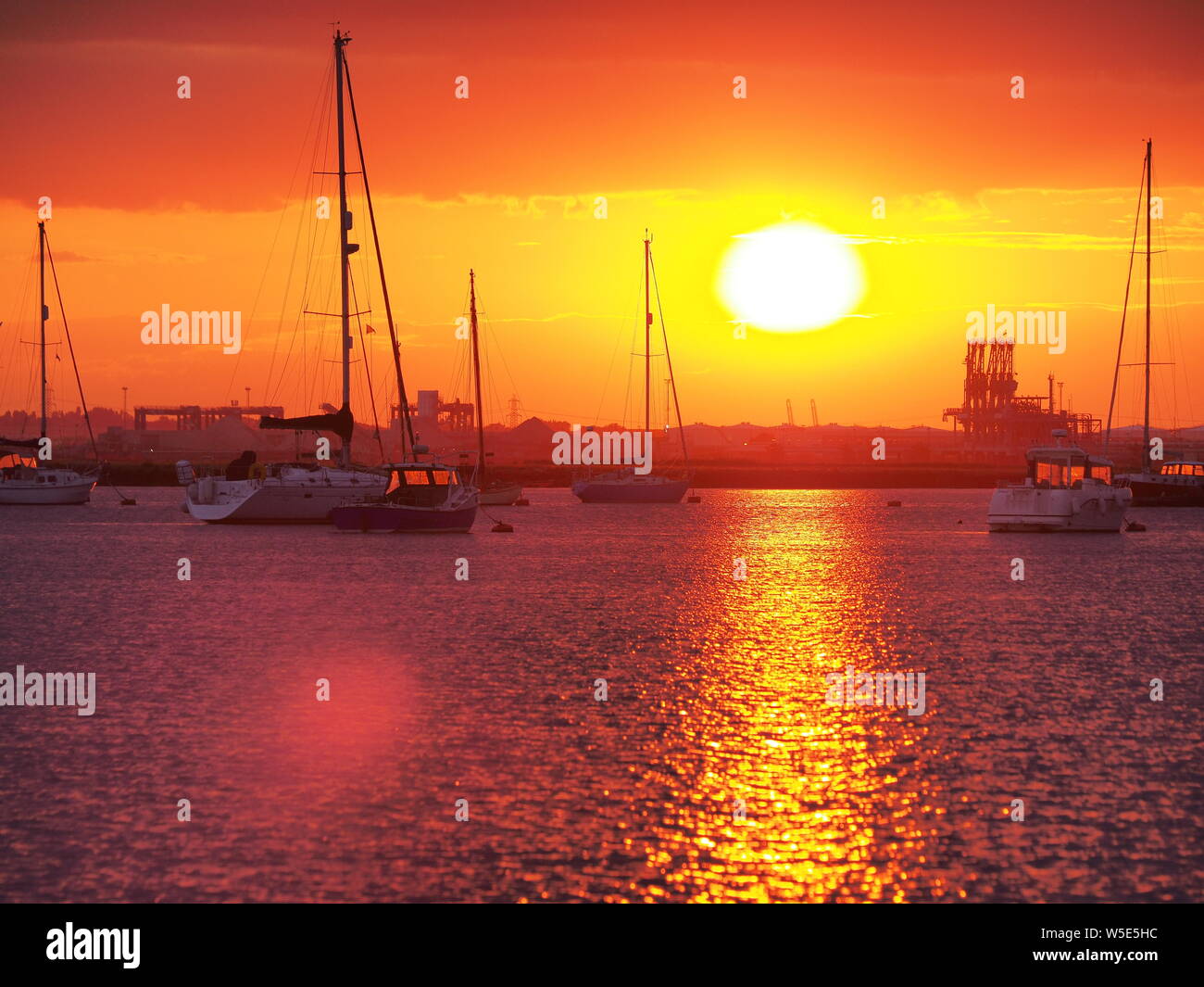 Queenborough, Kent, UK. 28th July, 2019. UK Weather: a glowing sunset ...