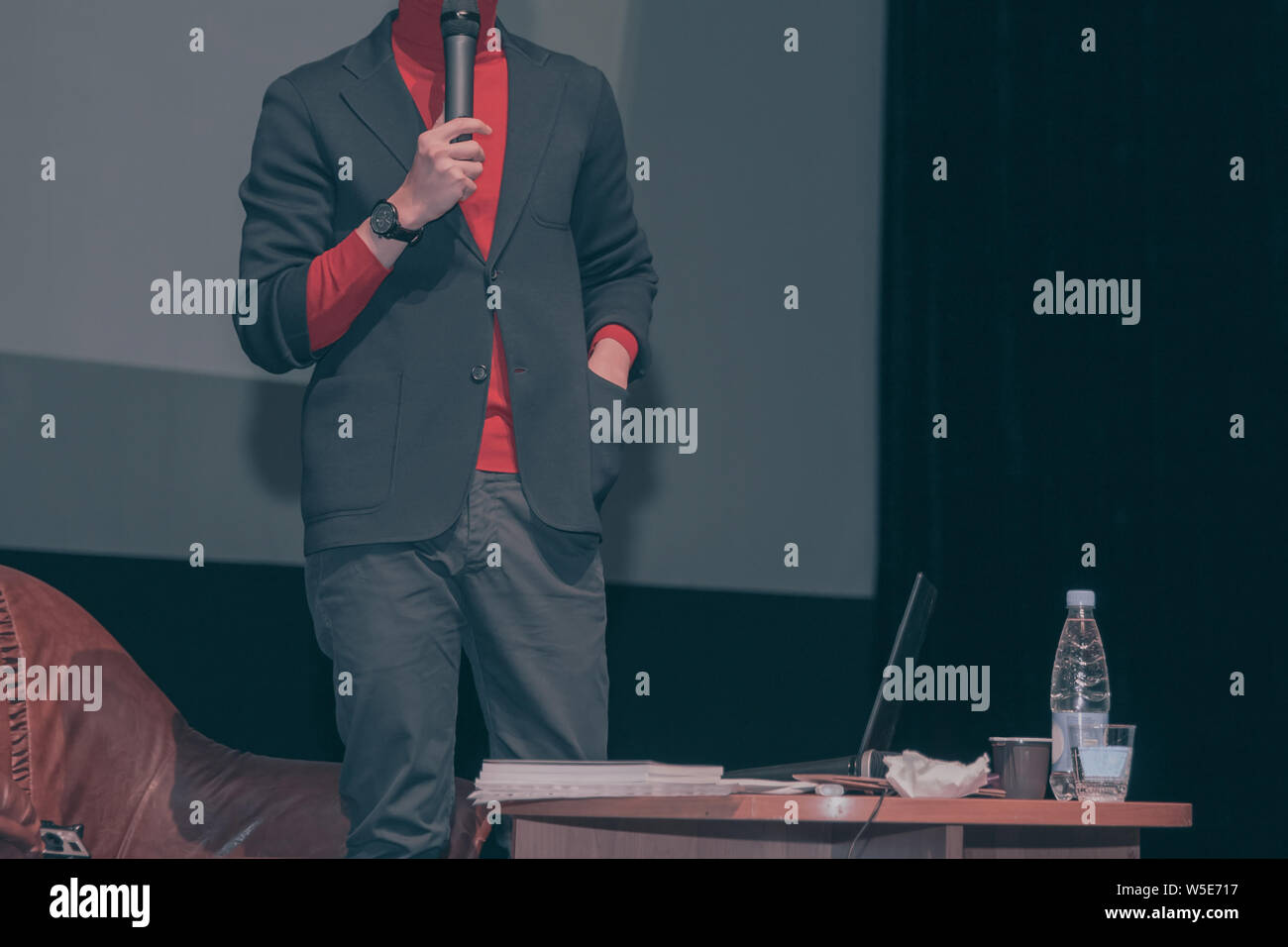 speaker, speaking on the podium at a corporate event. business and ...