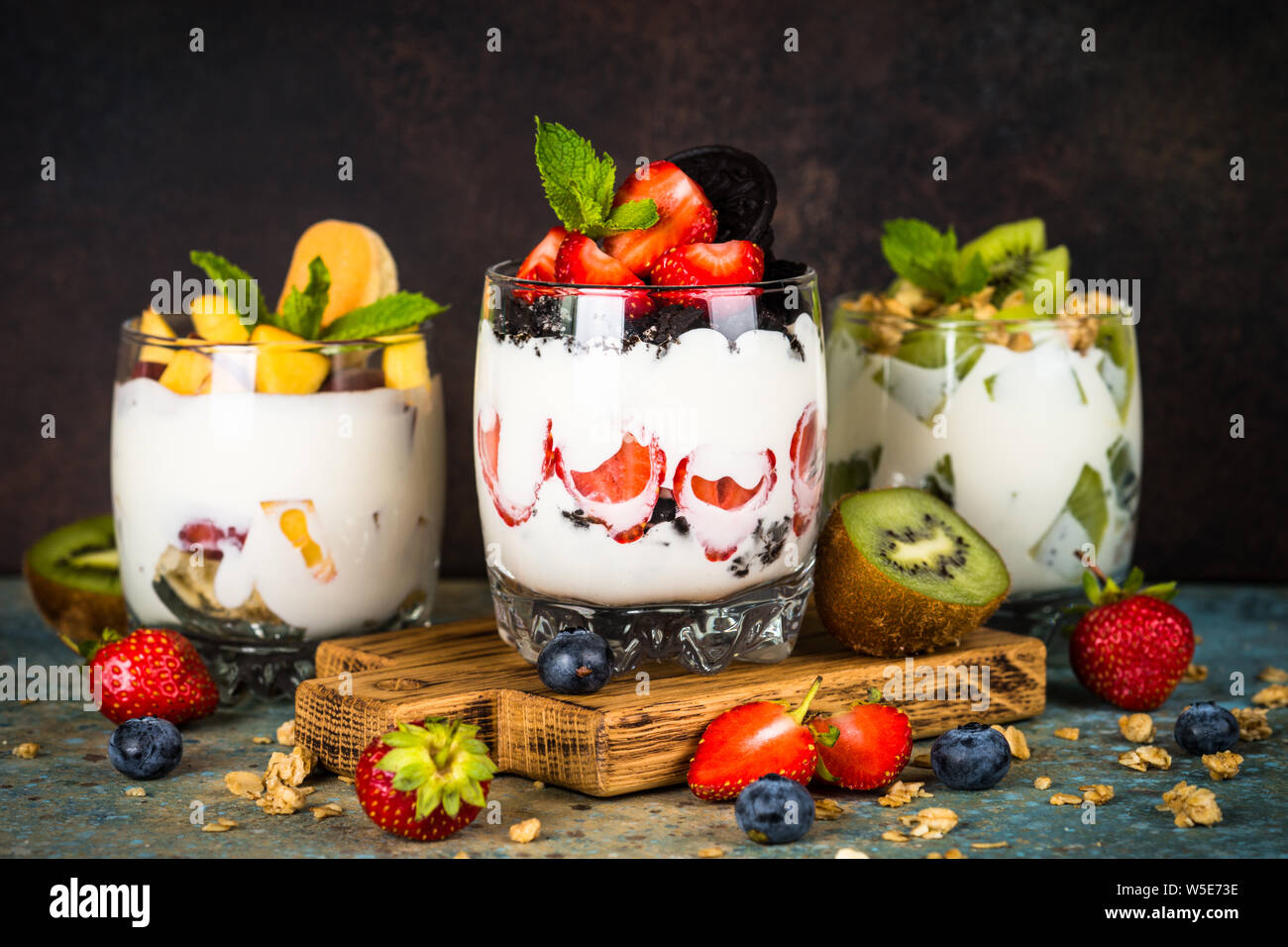 Fruit Dessert in glasses with yogurt and berries Stock Photo - Alamy