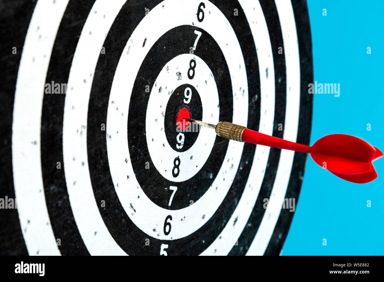 Aim with arrow in the center. Target on a blue background with a red ...