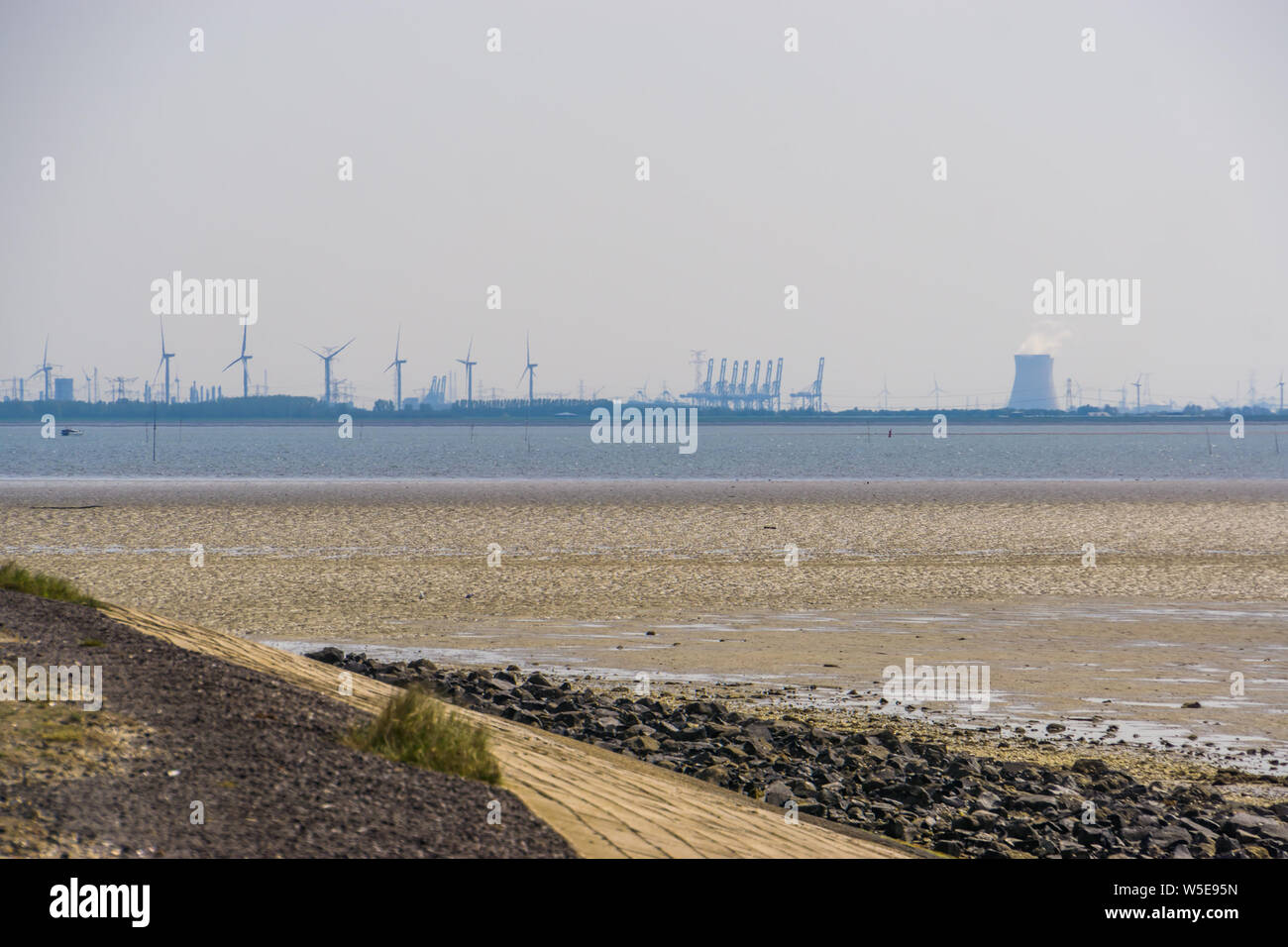 Tholen beach with view on the industrial zone, Bergse diepsluis ...
