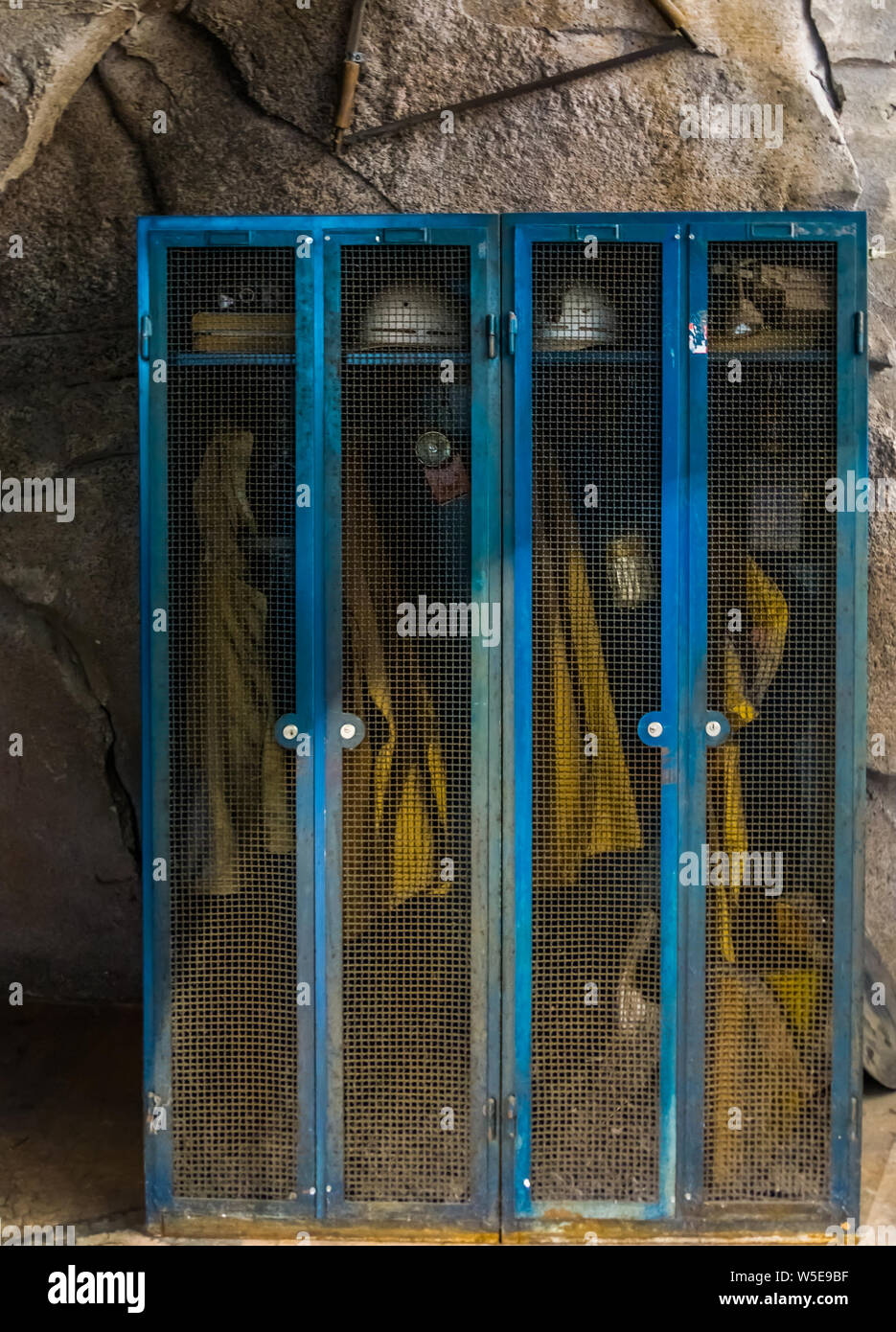historical miner lockers with work outfits, Nostalgic work equipment ...