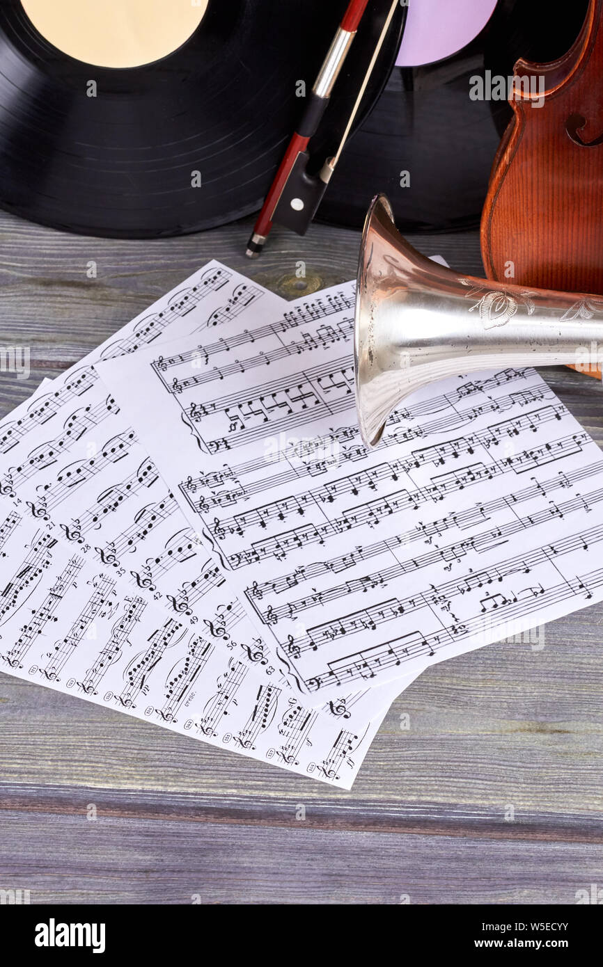 Musical notes and instruments on wooden background Stock Photo - Alamy