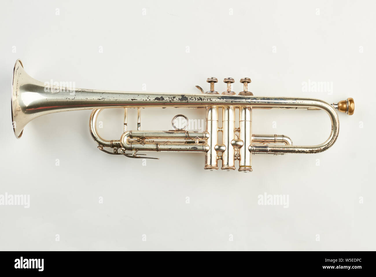 Rusty trumpet on white background Stock Photo - Alamy