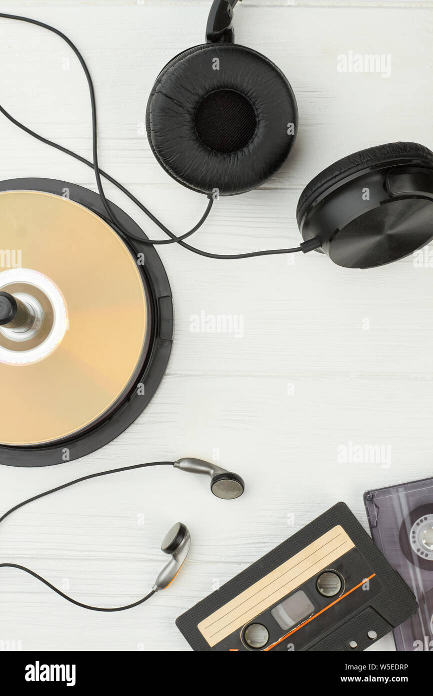Audio devices on white wooden background Stock Photo - Alamy