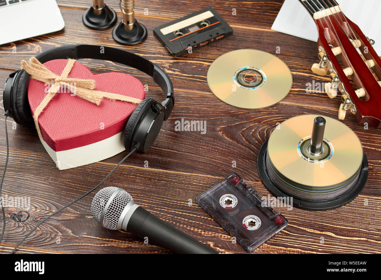 Wooden background with different musical equipment Stock Photo - Alamy