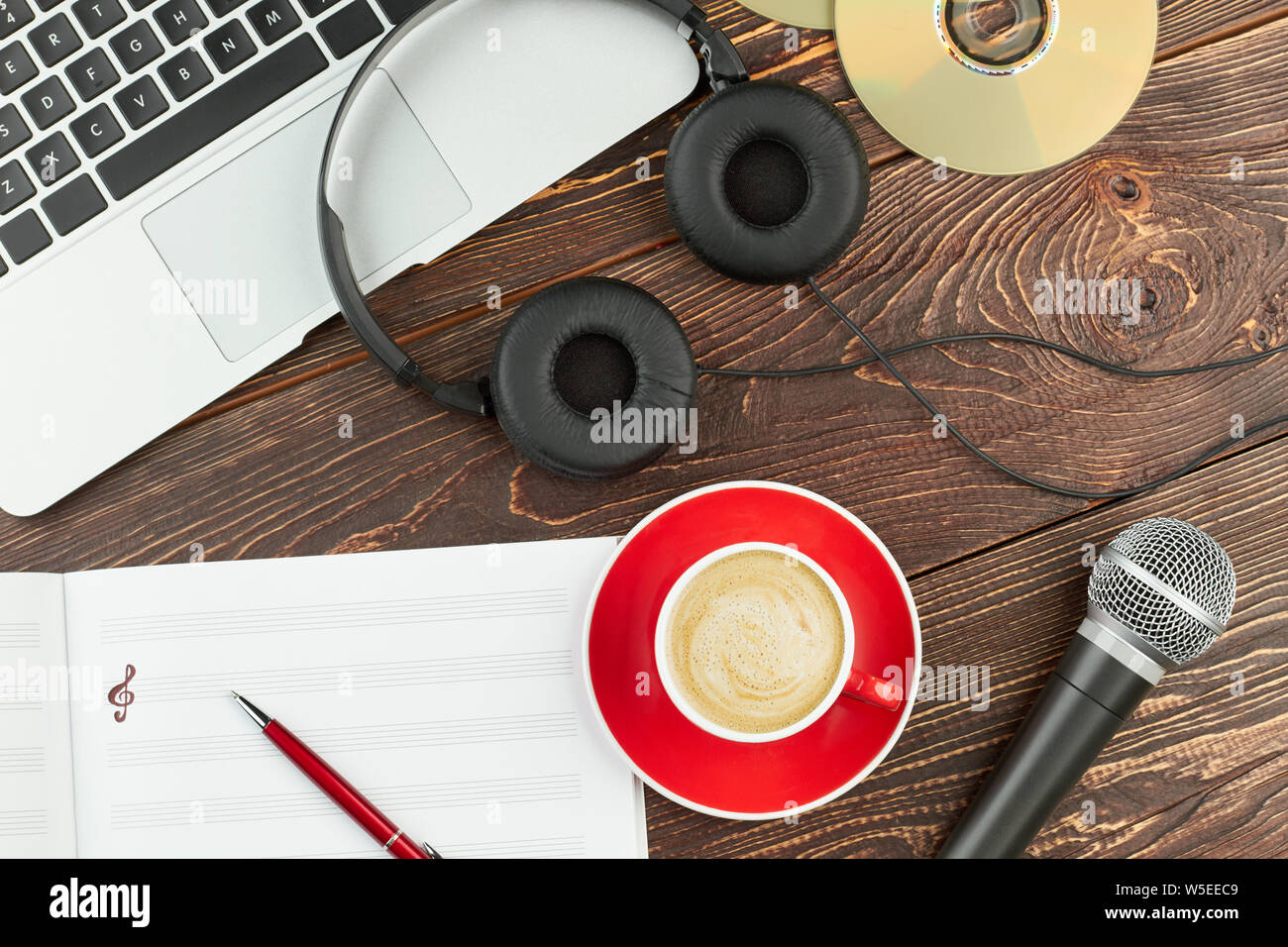 Wooden background with laptop and audio devices Stock Photo - Alamy