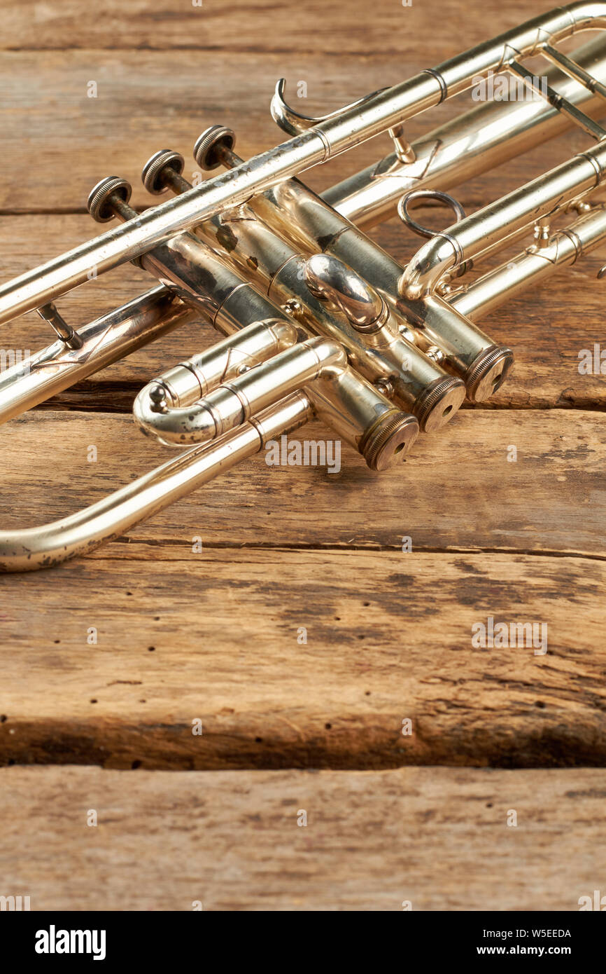 Rusty trumpet on wooden hi-res stock photography and images - Alamy