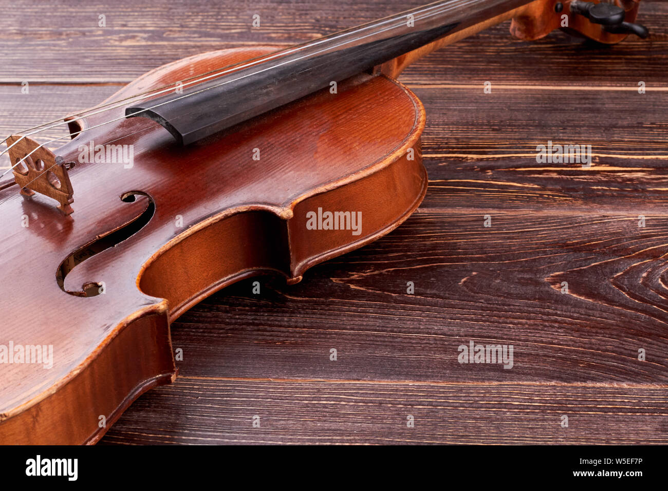 Old-fashioned violin on wooden background Stock Photo - Alamy