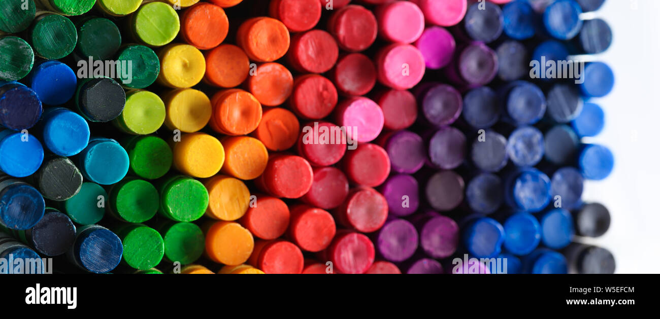 Box of crayons in a rainbow of colors background Stock Photo - Alamy