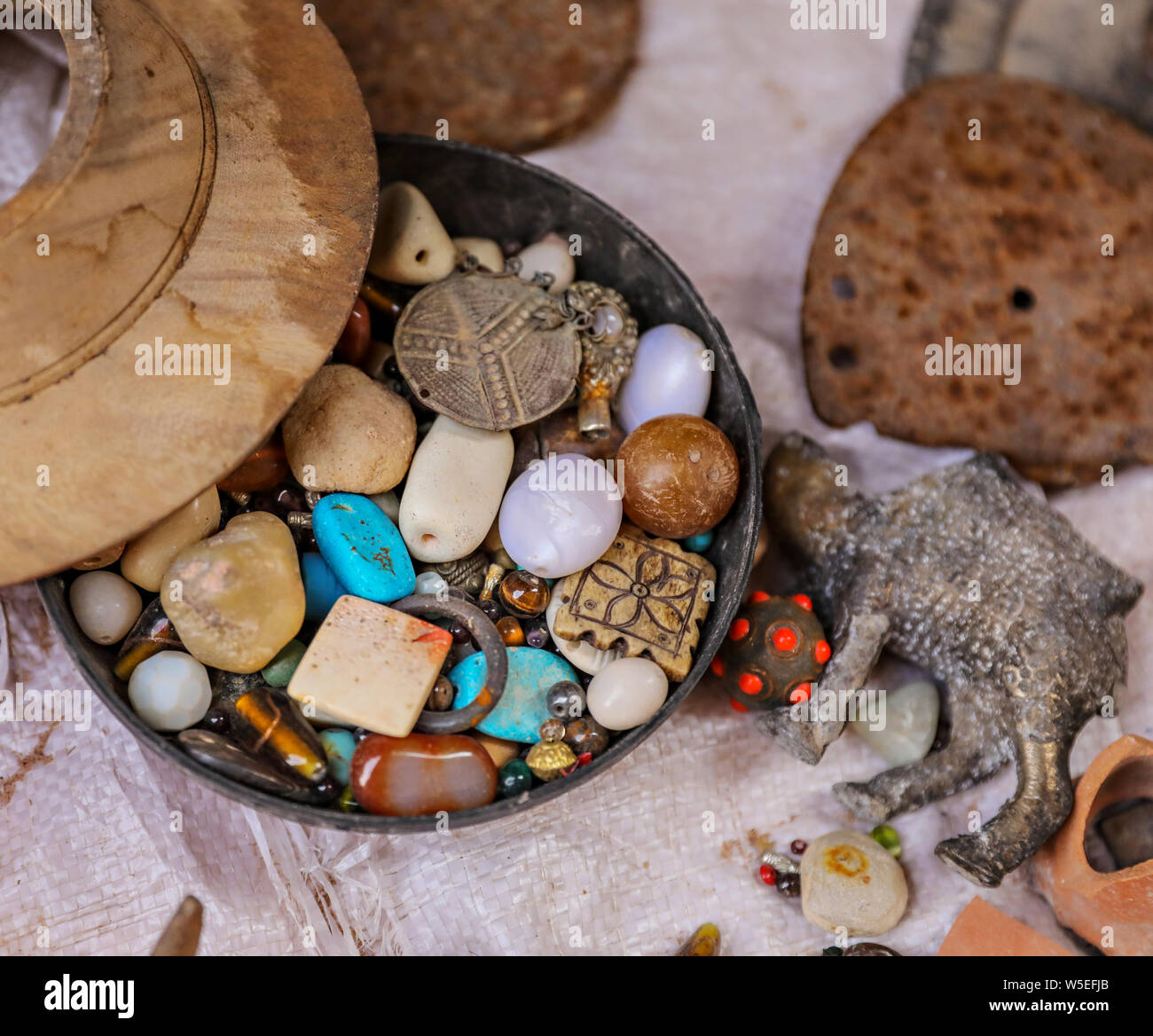 A collection of rocks and treasures in a metal bowl from the Middle ...