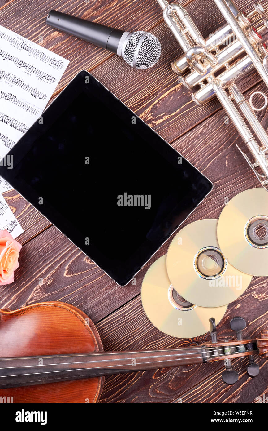 Vintage musical instruments and digital tablet Stock Photo - Alamy