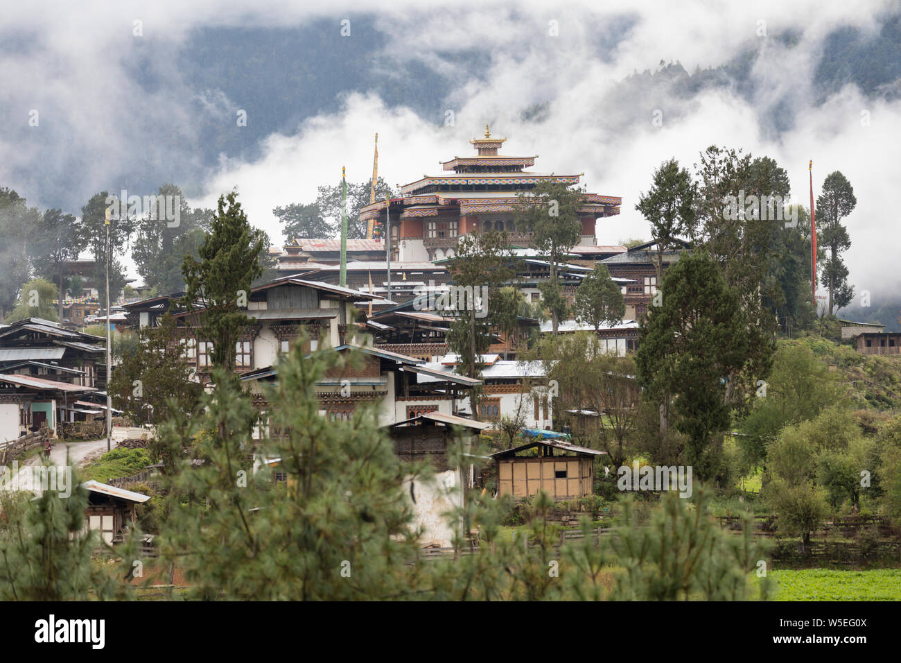 Mist-shrouded Gangtey Monastery and village in Phobjikha Valley, Bhutan ...